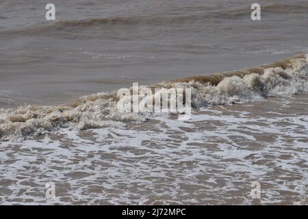 Sea serf of the Sea of Azov, the clay coast on a sunny day in summer ...