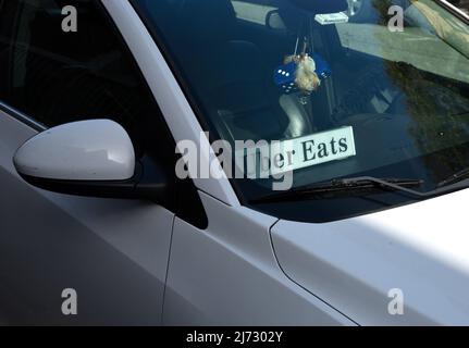 An Uber Eats car and driver making a delivery in San Francisco ...