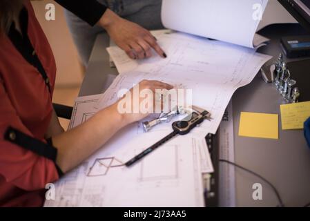 Engineer technician designing drawings mechanical parts engineering ...