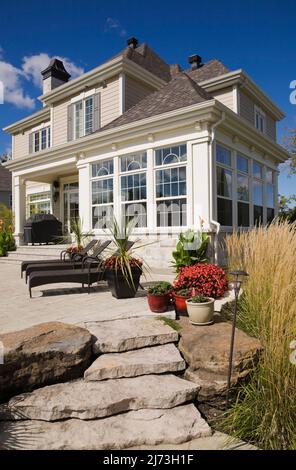 Vertical Backyard of two story house in American town Stock Photo - Alamy