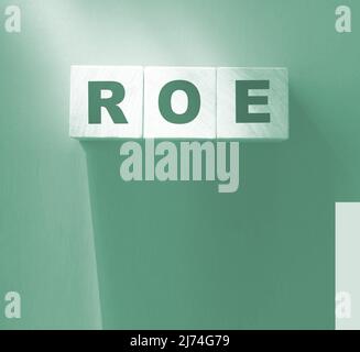 ROE on Wooden blocks and coins. Return on Equity. Business concept ...