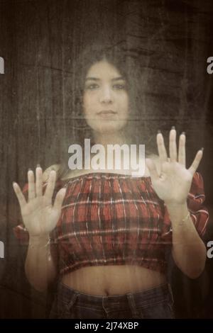 Woman standing behind dusty window Stock Photo - Alamy