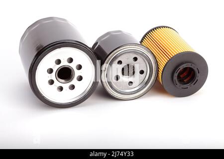 Three types of oil filters on a white background Stock Photo - Alamy