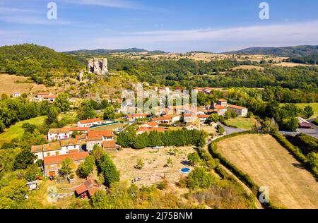 Aerial view of Domeyrat village with its castle in Auvergne, France ...