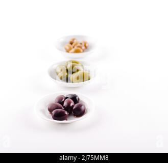Three green olives in a row Food still life Stock Photo - Alamy