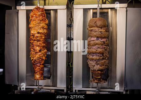 Grilled gyros on a rotary grill Stock Photo - Alamy