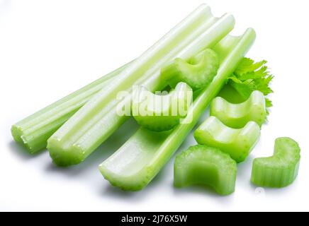 Pile of celery ribs and cuts isolated on white background Stock Photo ...