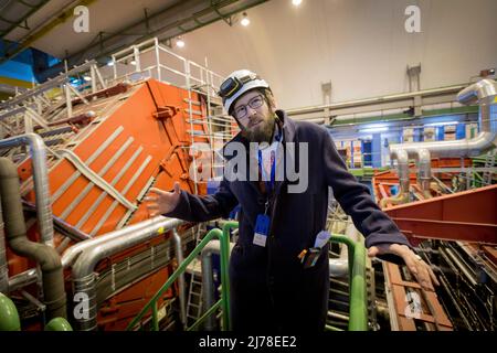 Norwegian scientist Arild Velure next to the ALICE detector on the LHC ...