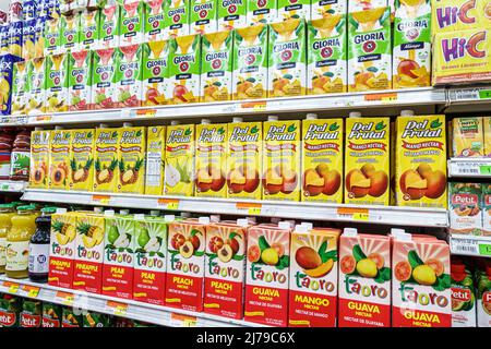 Containers with fruit juices on the shelves of a supermarket in the ...