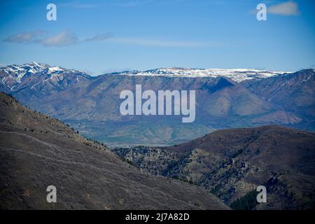 Early spring season at Snowbasin Ski Resort in Utah. Snow slopes on a ...