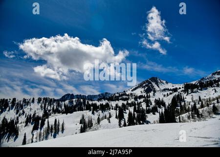 Early spring season at Snowbasin Ski Resort in Utah. Snow slopes on a ...
