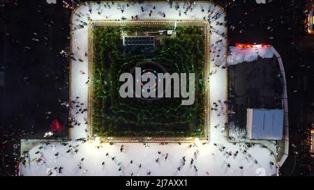 People Skating on an Open-Air Ice Skating Rink. Top view. Many People ...