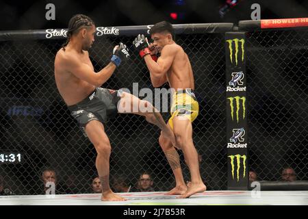 PHOENIX, AZ - MAY 7: (R-L) Kleydson Rodrigues kicks C.J. Vergara in ...