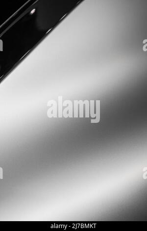Matte grey metallic texture with bends and black plastic details Stock ...