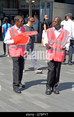 Olympic Volunteers help spectators in the rain at Greenwich Park ...