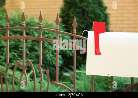 Vintage mailbox with red flag outdoors Stock Photo - Alamy