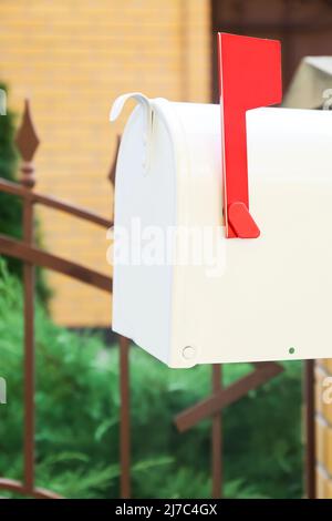 Vintage mailbox with red flag outdoors Stock Photo - Alamy