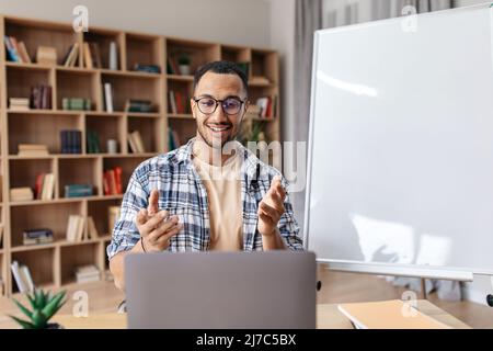 Happy colleagues standing near whiteboard at workplace Stock Photo - Alamy