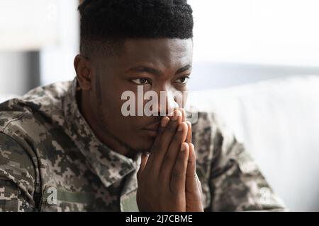 Thoughtful military guy staring at copy space Stock Photo - Alamy
