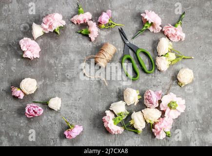 Florist workplace: carnations and roses on stone background Stock Photo ...
