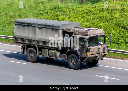 British army MAN SV HX 60 4x4 18.330 platform truck, part laden on a ...