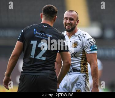 Ollie Griffiths of Dragons, and Owen Watkin of Ospreys, share a joke ...