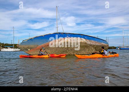 Kayaking past a wrecked yacht in the Port River Stock Photo - Alamy