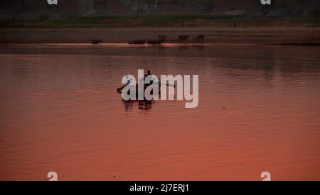 Pakistani people enjoying boating in Ravi River during sunset in Lahore ...