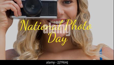 Smiling woman photographer with camera Stock Photo - Alamy