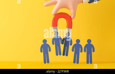 Hand holding a magnet attracting new customers or recruiting new staff ...