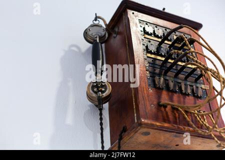 Details of the antique telephone set made of wood Stock Photo - Alamy