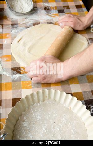 Sooking and home concept - close up of male hands kneading dough on a ...
