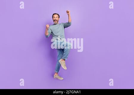 Full size photo of delighted overjoyed girl sit carpet floor use ...