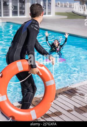 Scuba Diving rescue course surface skills checking for breathing of an ...