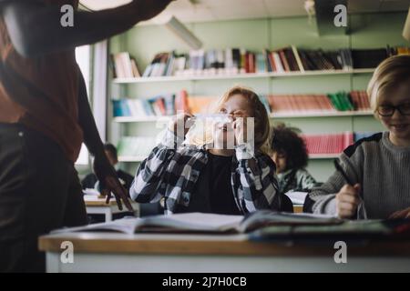 Group Of Children Copying Teacher In Montessori/Pre-School Class Stock ...