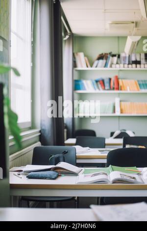 books and empty classroom in school for back to school concept and open ...