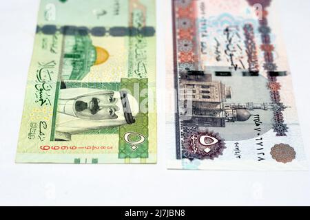 Obverse sides of an old Saudi Arabia 10 ten riyals banknote with 10 LE ...