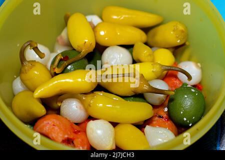 Egyptian pickles inside a deep plastic bowl, marinated preserved ...