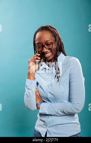 Happy smiling heartily woman having smartphone with green screen ...