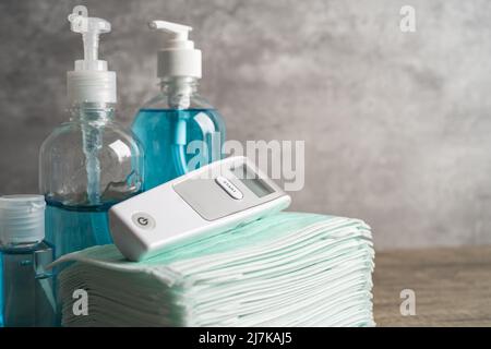 Blue alcohol sanitizer gel with digital thermometer and mask for new ...