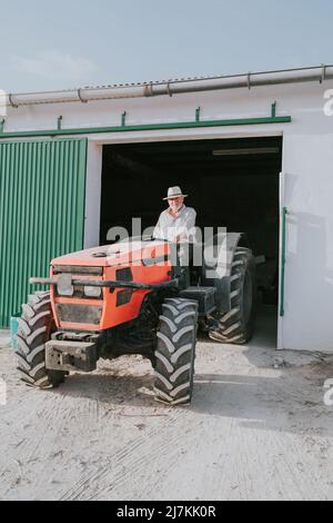 A tractor in a garage in a rural area Stock Photo - Alamy