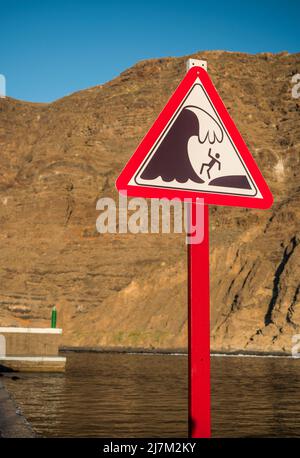 Caution of Big Waves. Road sign mounted on breakwater in Taiwan ...