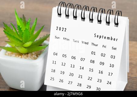 The September 2022 desk calendar with plant on wooden table Stock Photo ...