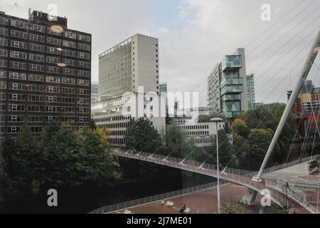 Trinity Bridge is a three-way footbridge which crosses the River Irwell ...