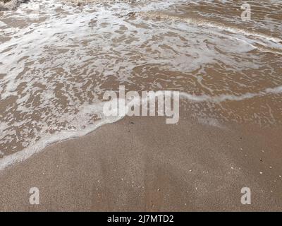 Sea serf of the Sea of Azov, the clay coast on a sunny day in summer ...