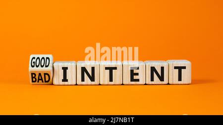 Good or bad intent symbol. Turned wooden cubes and changed concept ...