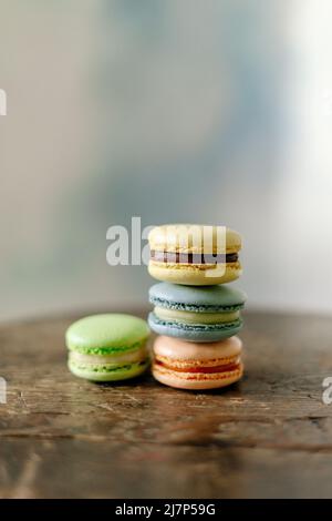 Green macarons on a wood table for coffee or a tea Stock Photo - Alamy