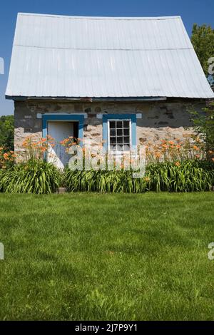 Old small circa 1775 fieldstone home with blue and white trim, grey ...