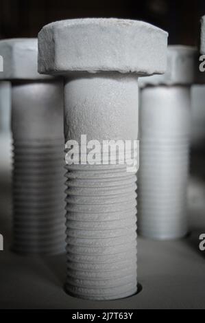 A factory in large bolts and close-up shoot, big gray bolts Stock Photo ...