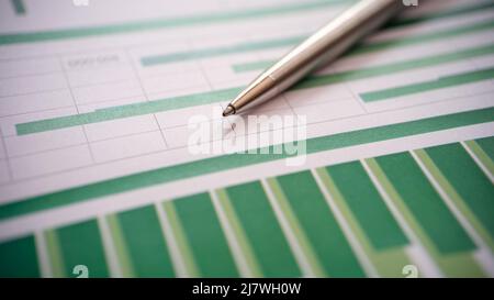 Closeup of analyzed graphs and charts with pen in office Stock Photo ...